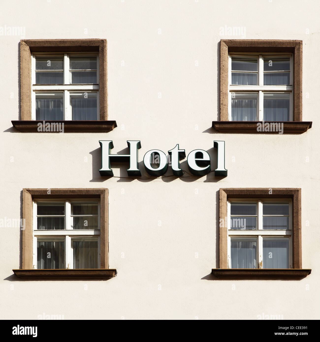 Wall of hotel close-up with windows and singboard Stock Photo - Alamy