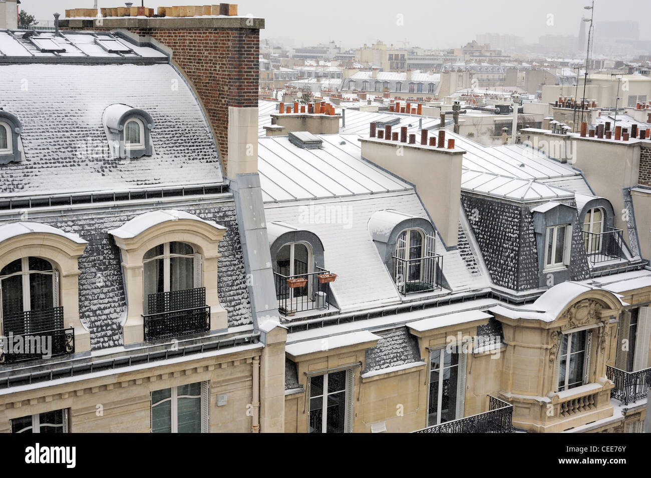 Rooftops of Parisian buildings under snow, Paris, IDF, France, Europe ...