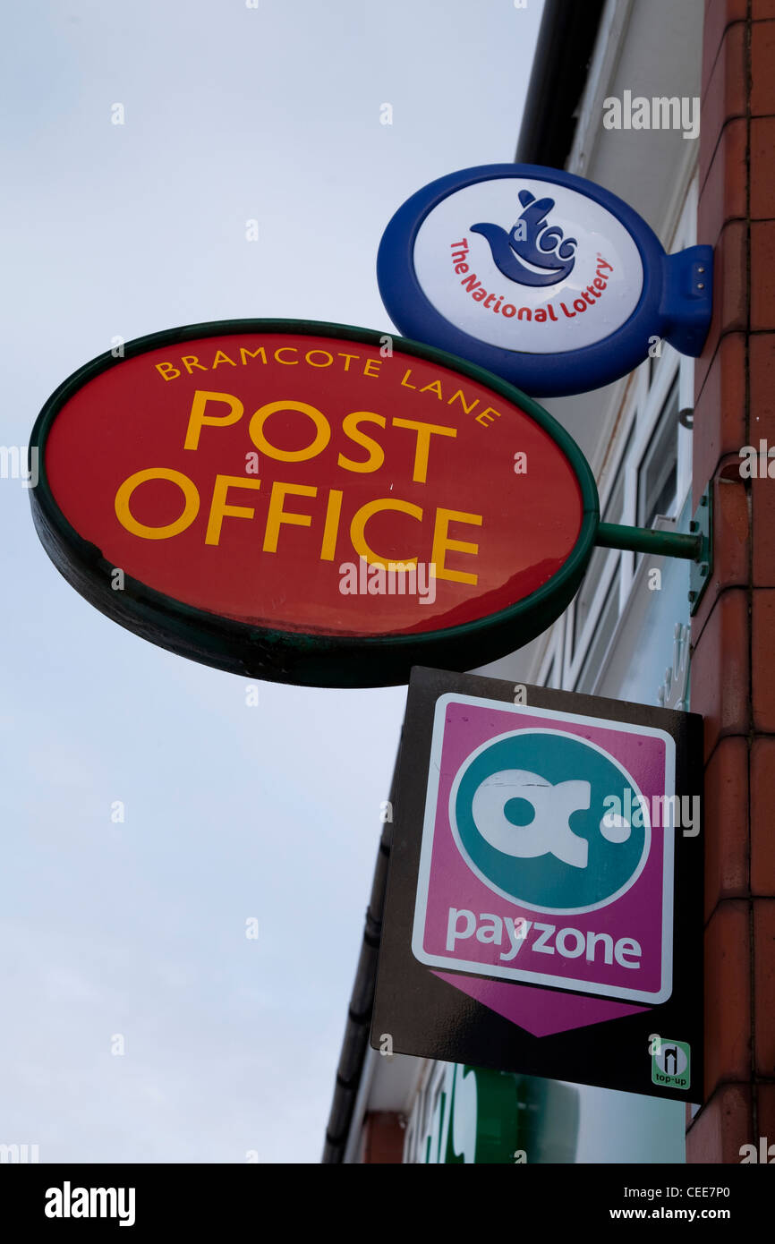 Post Office facilities payzone and national lottery signs outside ...