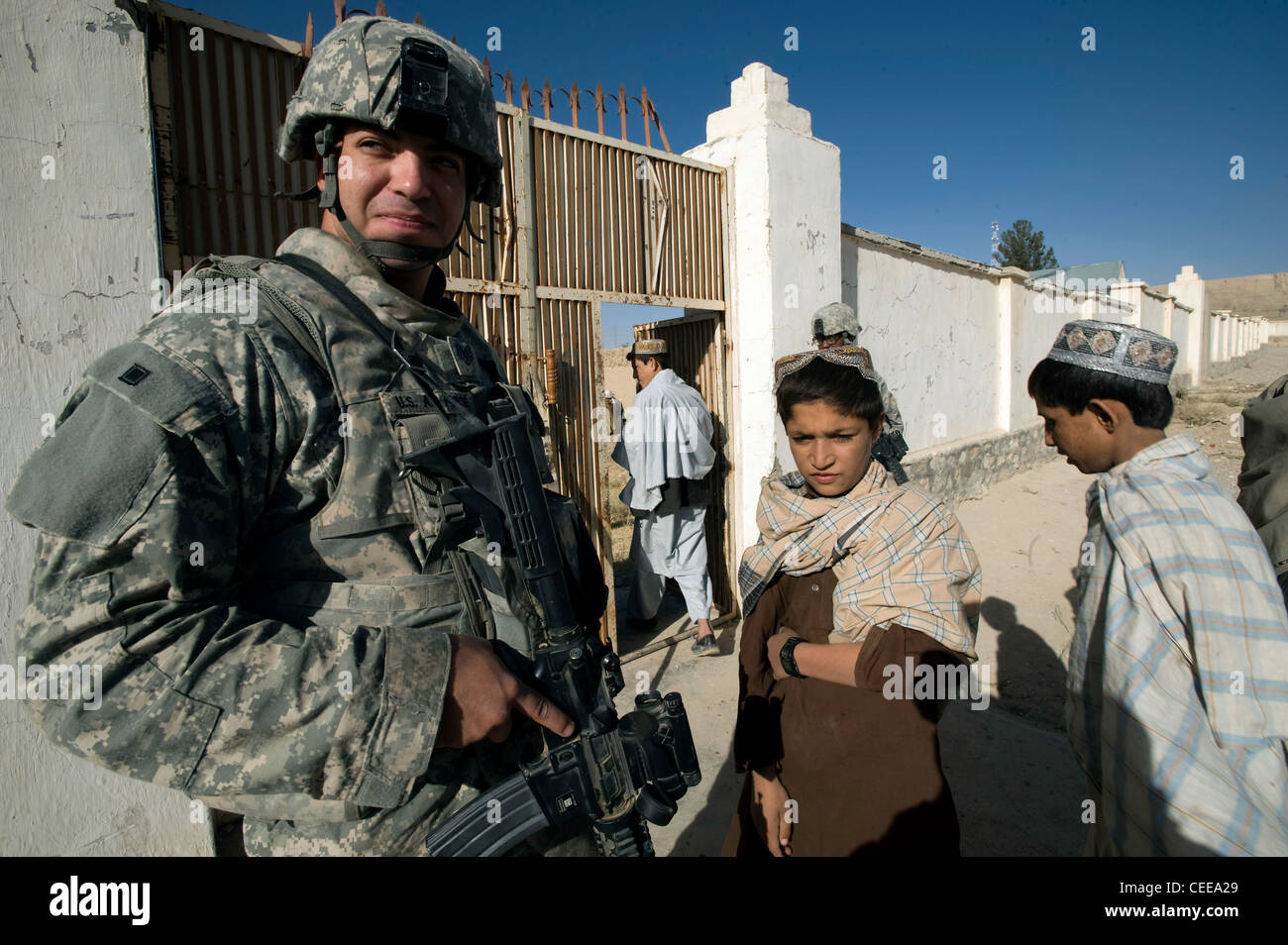 Staff Sgt. Joe Montano provides security at the entrance of the Kuchi ...