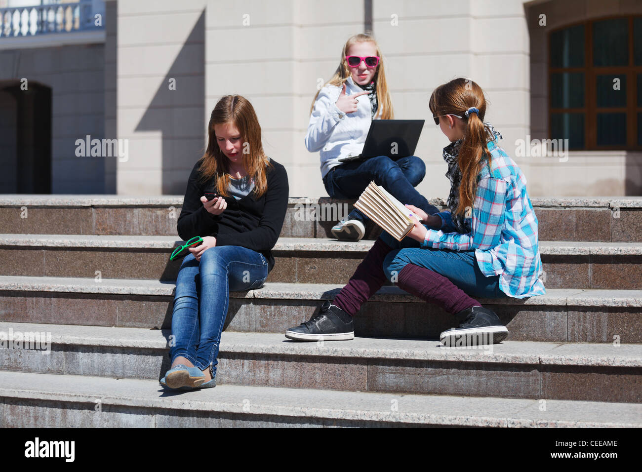 Teenage schoolgirls on the steps Stock Photo - Alamy