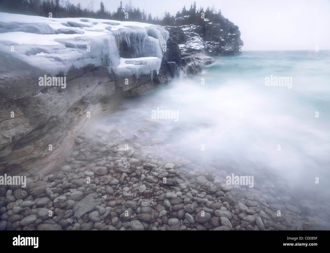 Frozen rocks on a shore of Georgian Bay in winter. Landscape nature ...