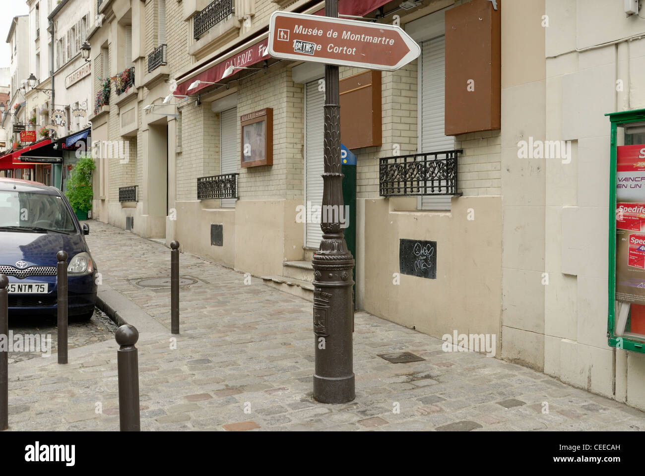 Paris street sign displaying the direction of the Montmartre Musee ...