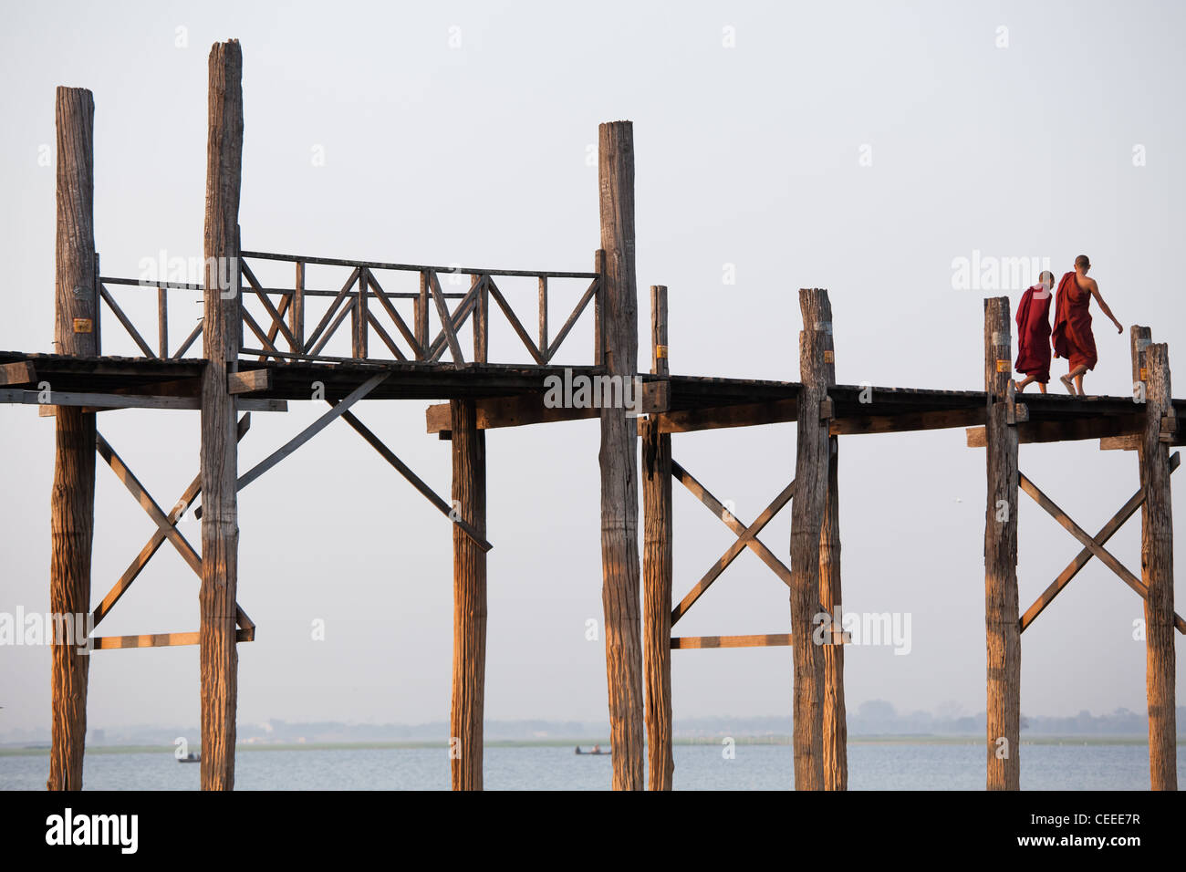 The longest ancient teak wood bridge with walking monks. U-Bein bridge ...