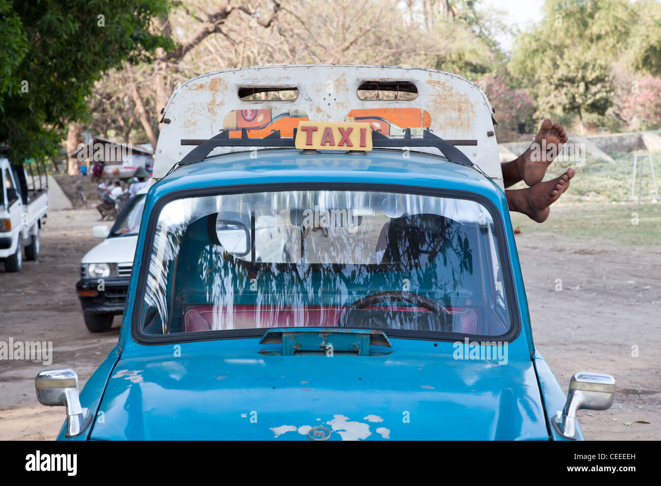 Relaxing taxi driver in Amarapura, Burma Stock Photo - Alamy