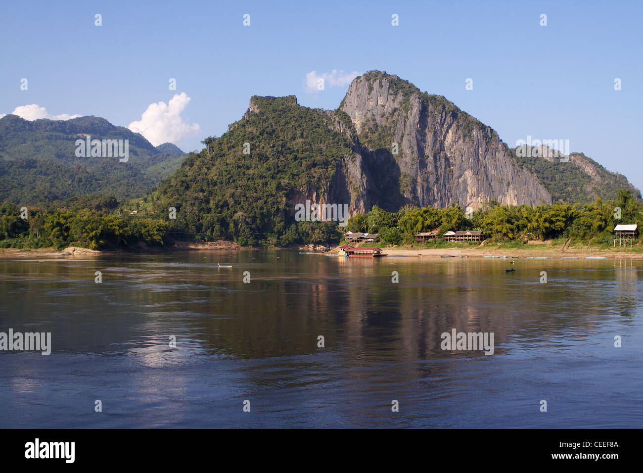 View across the Mekong river from Ban Pak Ou towards cliffs and jungle ...