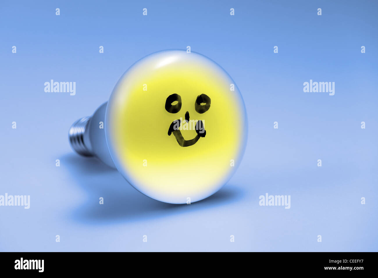 Smiling light bulb Stock Photo - Alamy