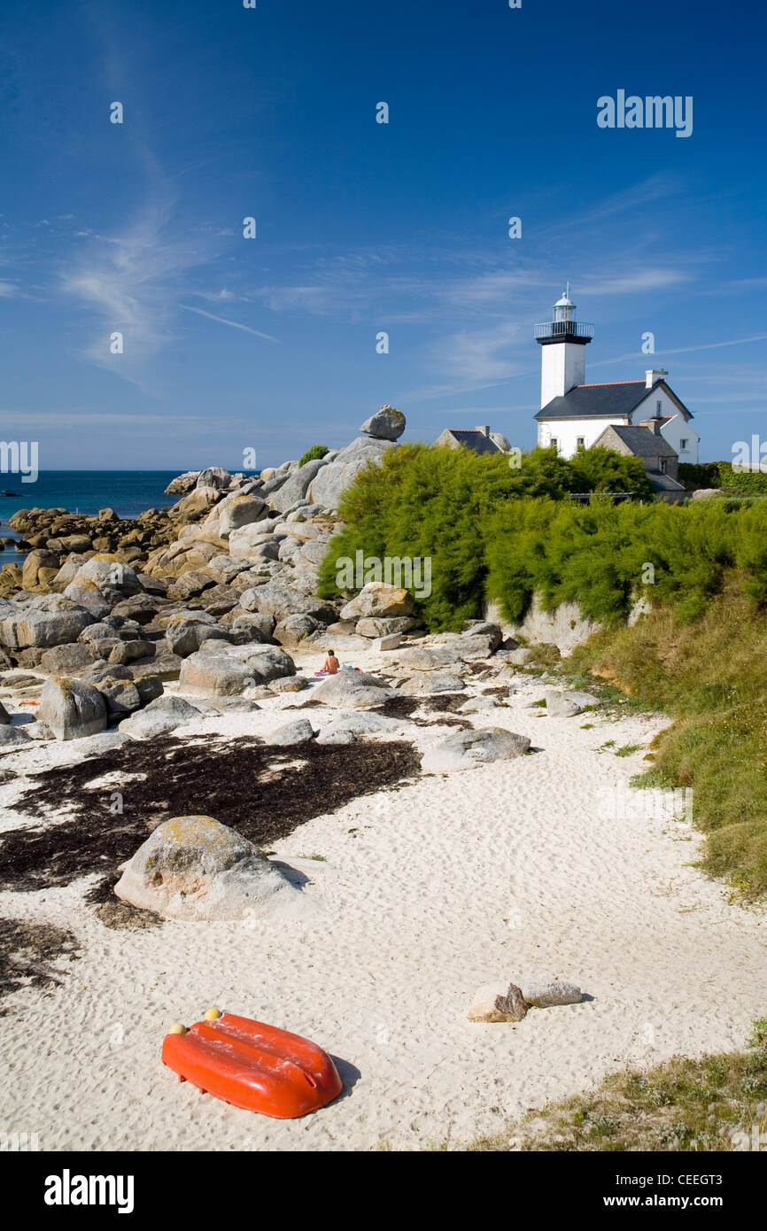 A small red boat on the beach at Pointe de Pontusval Lighthouse, Pointe ...