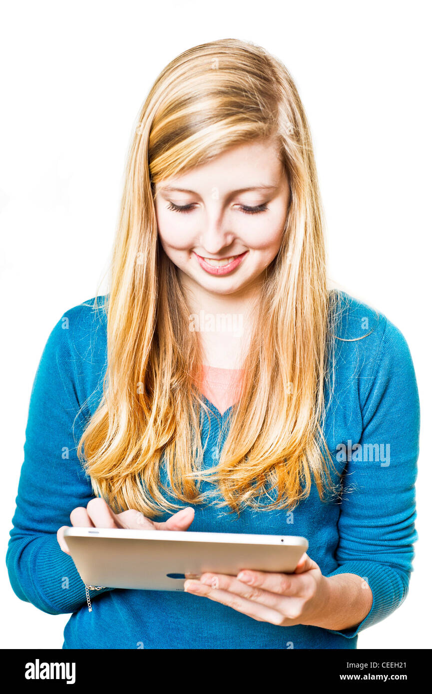 blond teenager girl using an iPad tablet computer Stock Photo - Alamy