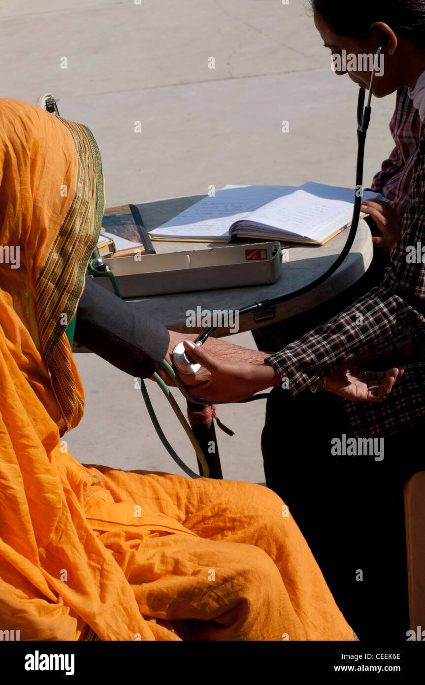 Nurse measuring blood pressure of a widow, Ma Dham Ashram, run by NGO ...