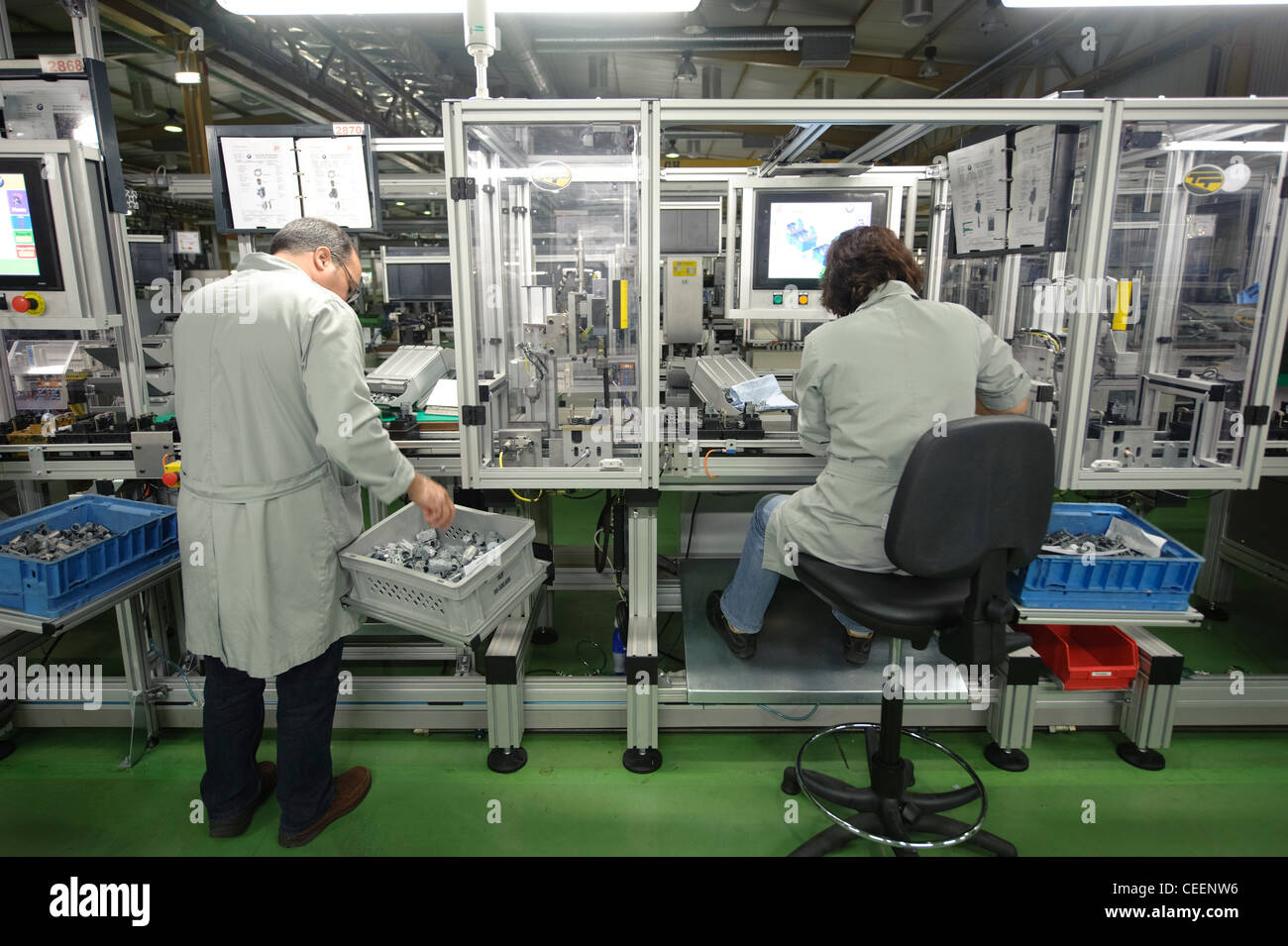 Factory workers at the assembly line Stock Photo - Alamy