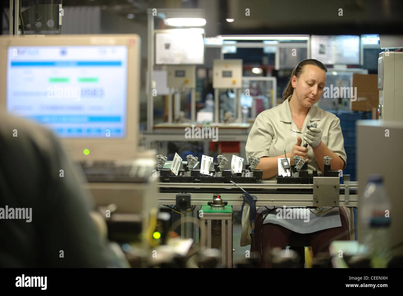 Factory workers at the assembly line Stock Photo - Alamy