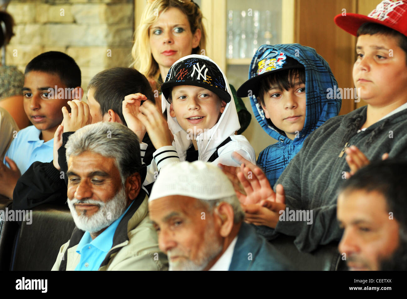 mixed crowd of school boys and local community Stock Photo - Alamy