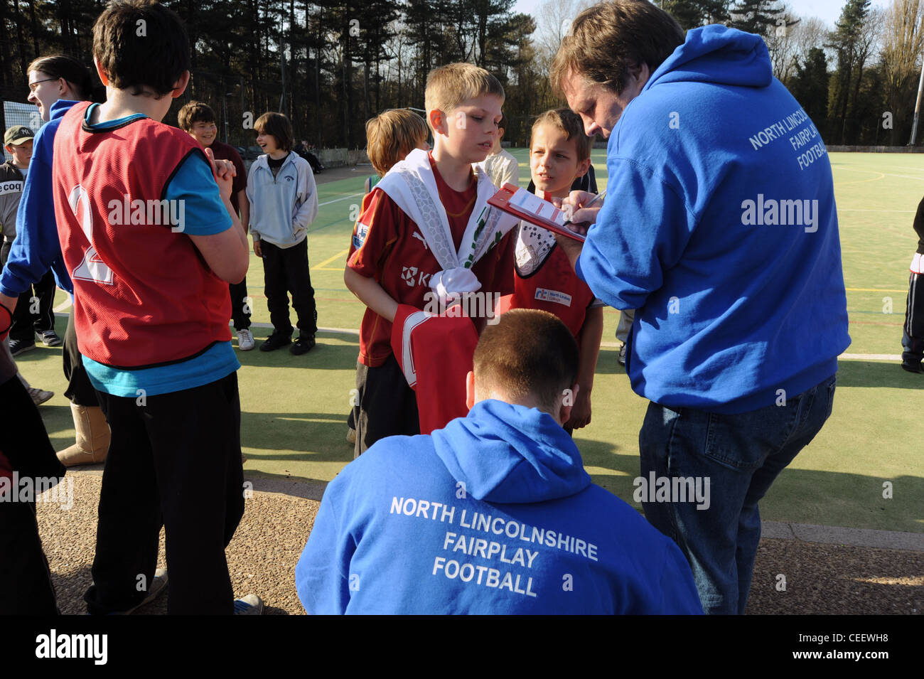 children sign in to the register at children's football play scheme UK ...