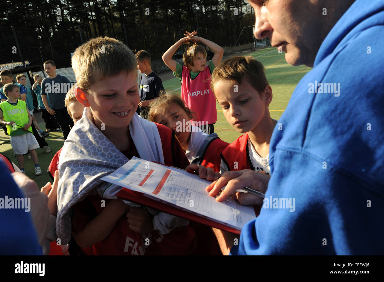 children sign in to the register at children's football play scheme UK ...