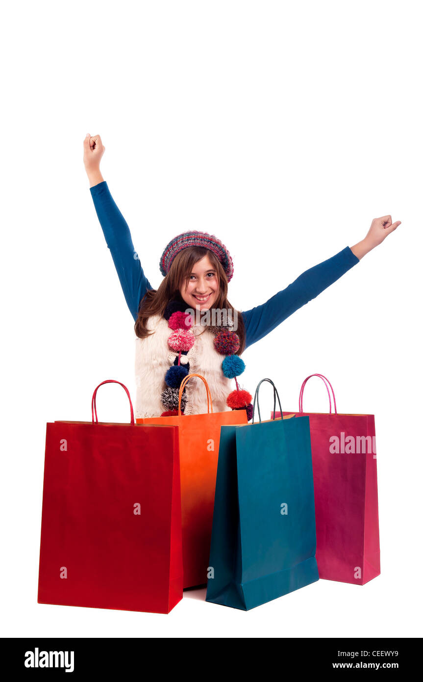 Beautiful young girl posing with shopping bags isolated in white Stock ...