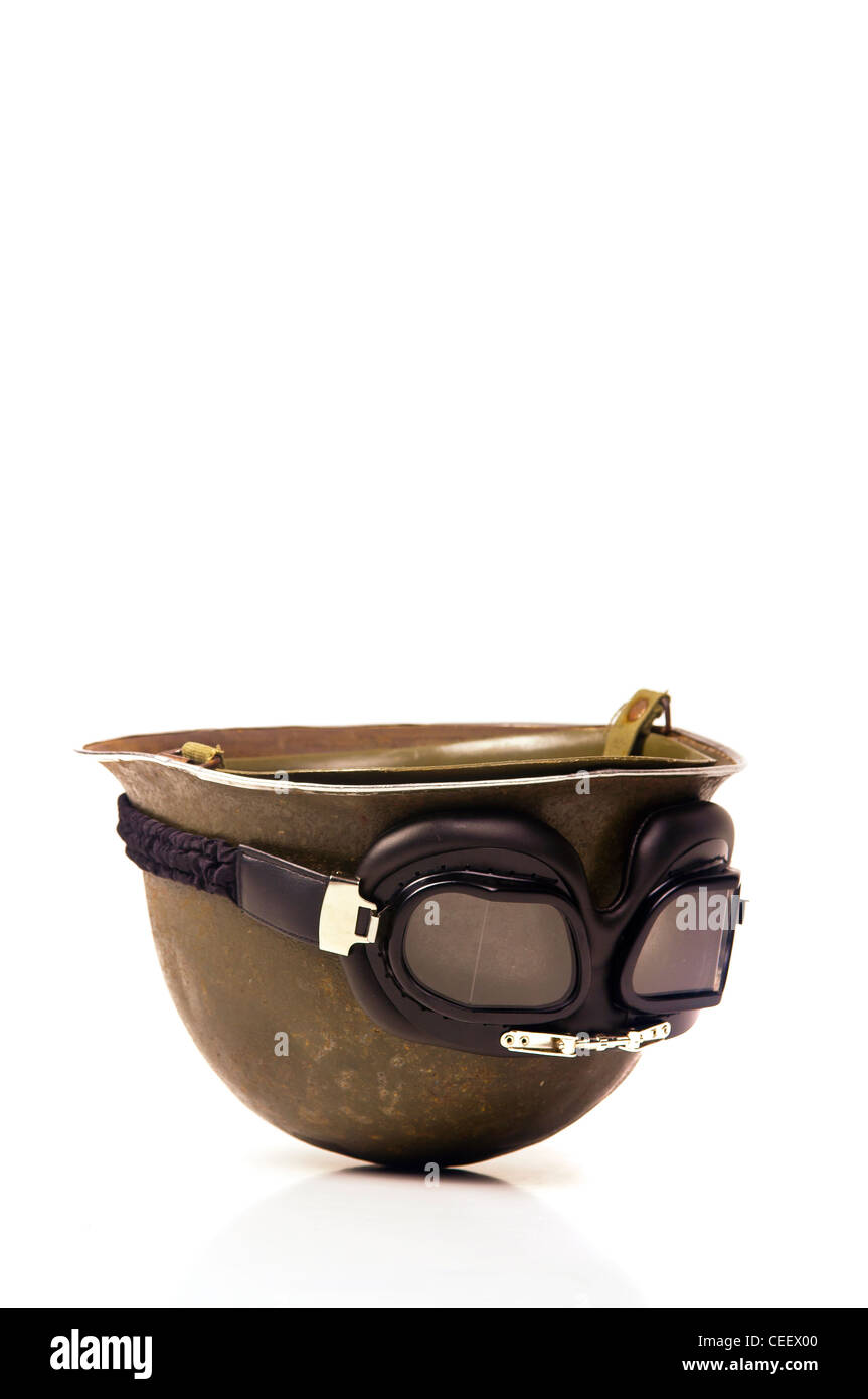 Old soldiers helmet with goggles isolated in white Stock Photo - Alamy