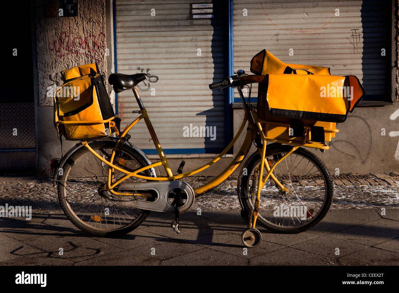 Yellow postmans bike in the Kreuzberg district of Berlin, Germany Stock ...