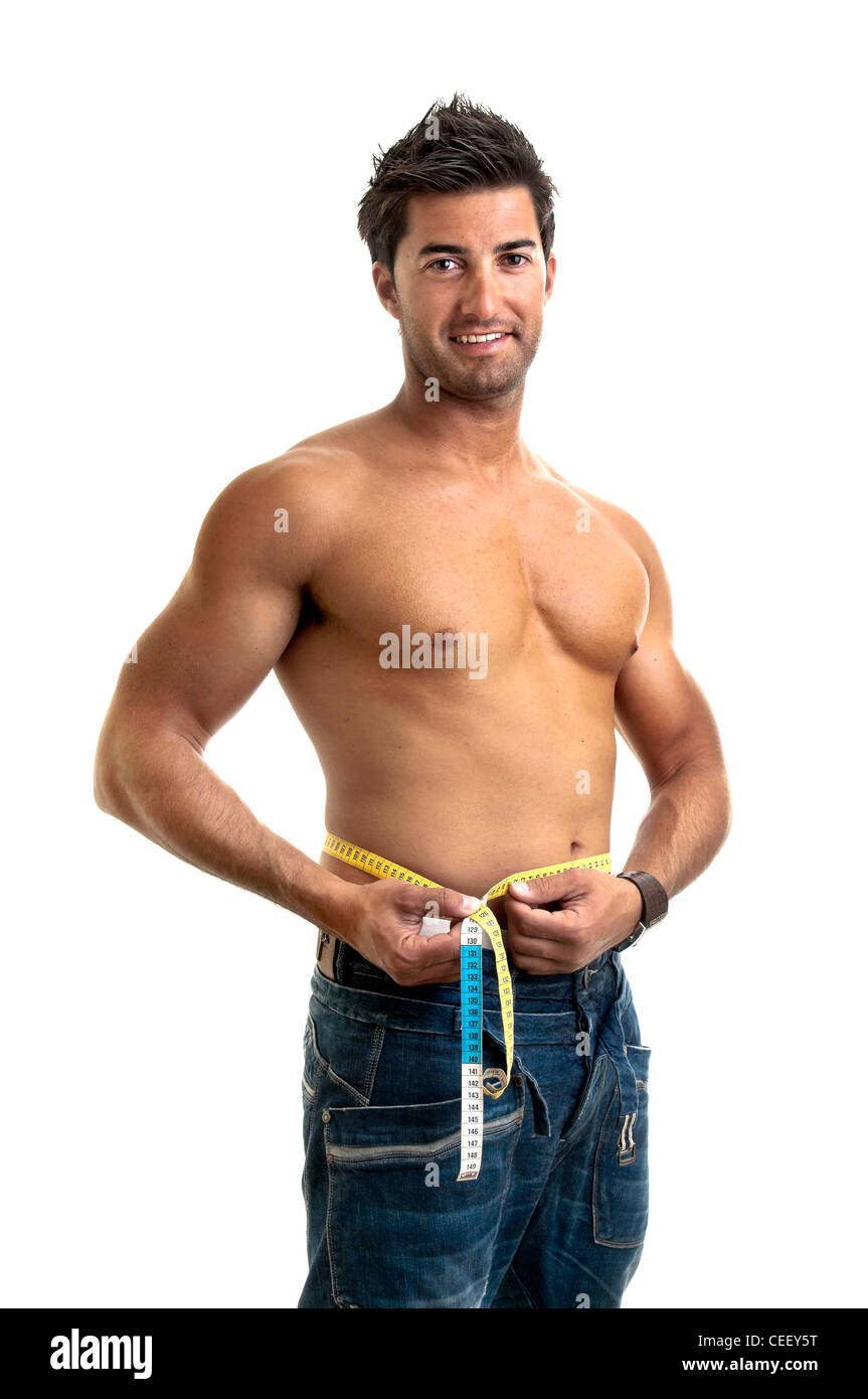 Muscular young man with measuring tape Stock Photo - Alamy