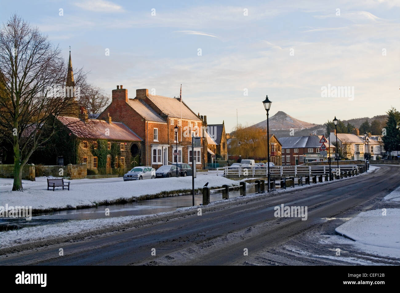 Village of Great Ayton and River Leven in snow, early morning, seen ...