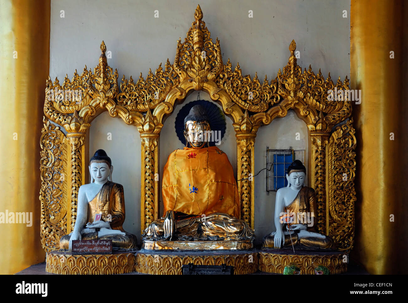 statue statues buddha buddhist gold orange yellow robe robes robed ...