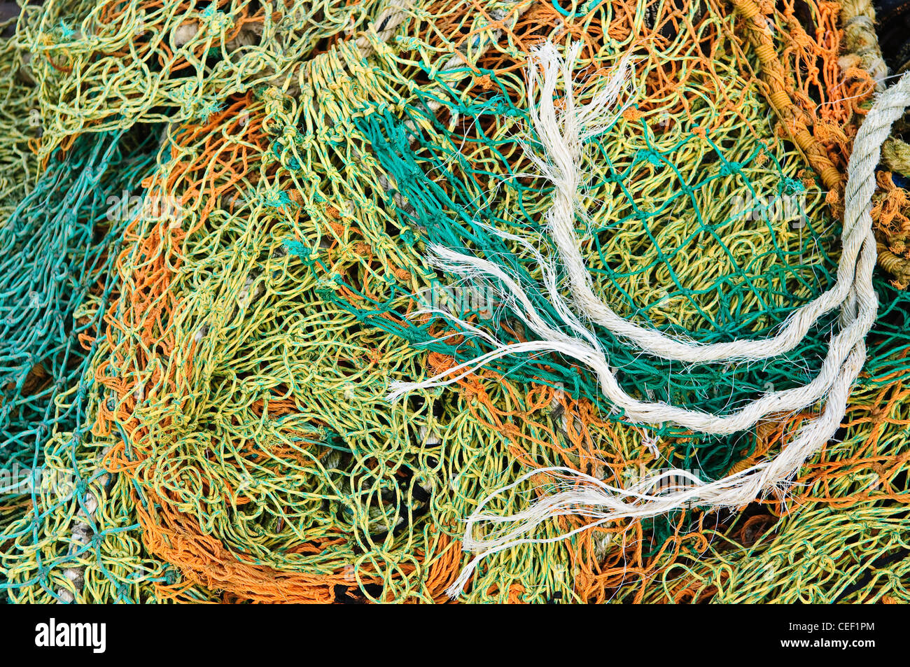 Tangled fishing nets on the old wooden pier Stock Photo - Alamy