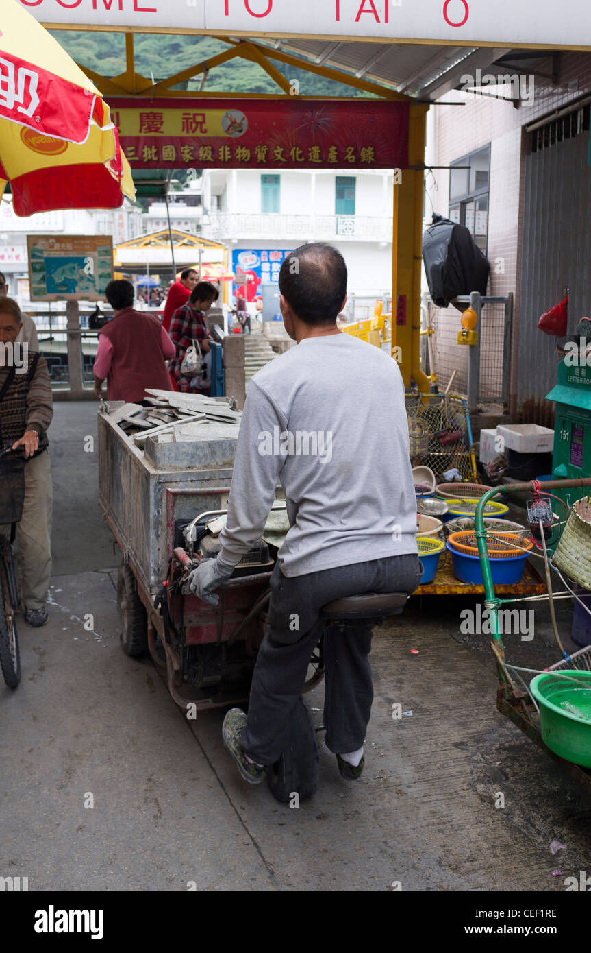dh Tai O LANTAU HONG KONG Man delivering building materials motorised ...