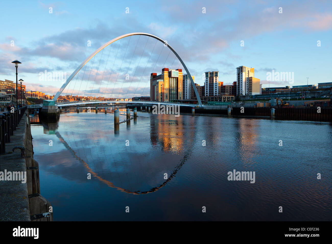 Gateshead Millennium Bridge and its reflection between Newcastle upon ...
