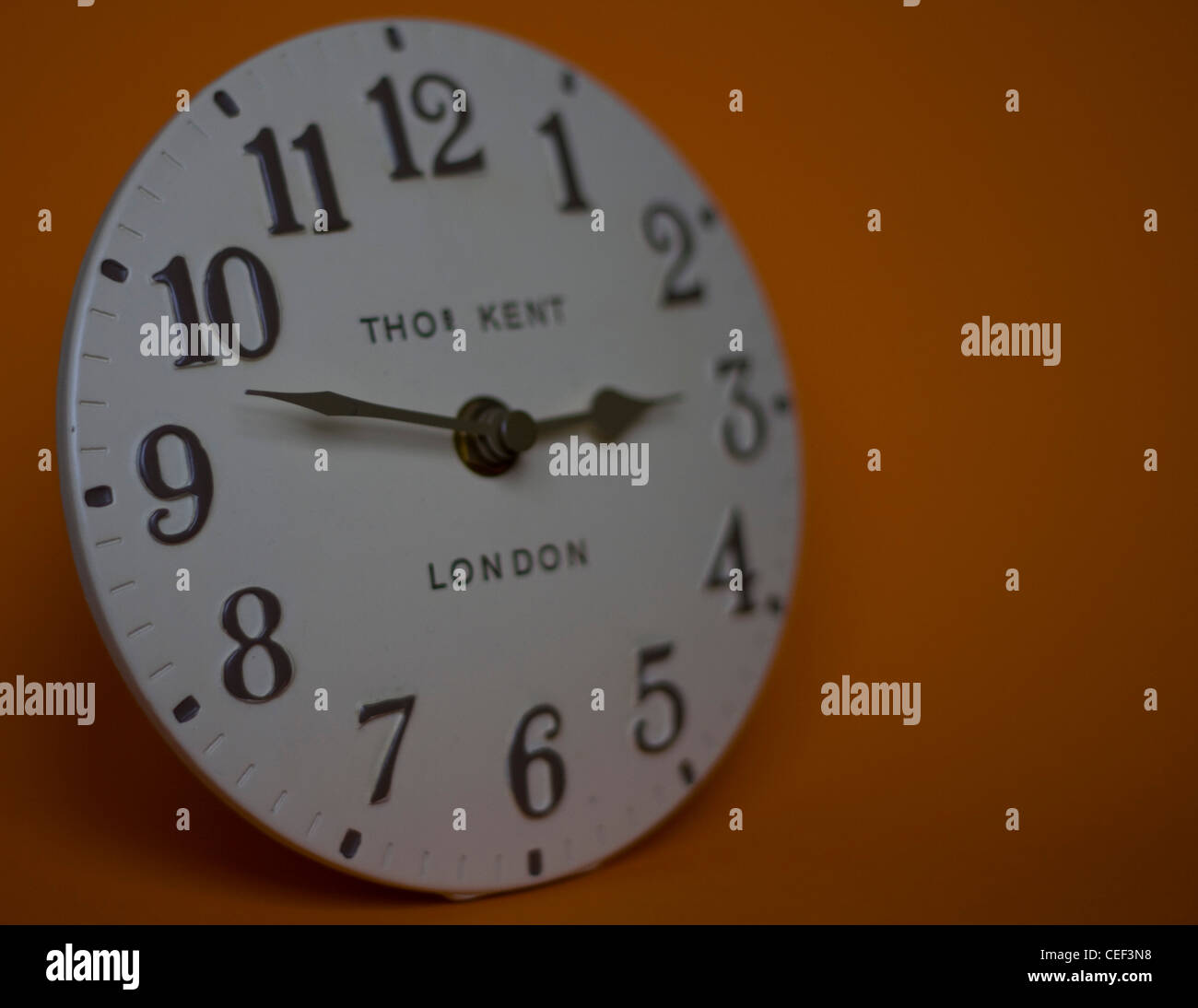 An old-fashioned analogue clock showing 10 to 3 Stock Photo - Alamy