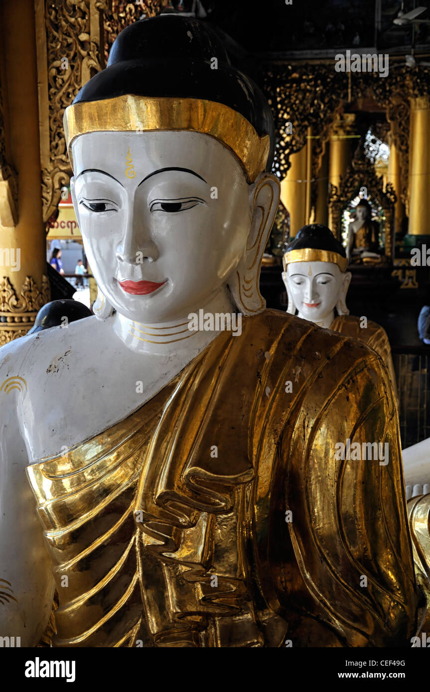statue statues buddha buddhist gold orange yellow robe robes robed ...