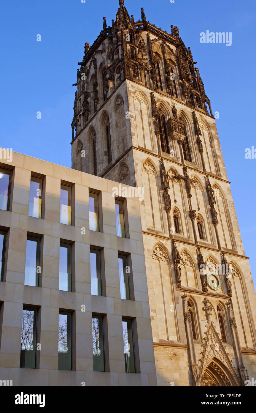 Church of our Ladies tower with the modern Diocesan library building in ...