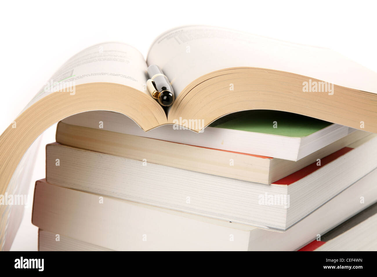 Books Stack and pen close up shot Stock Photo - Alamy