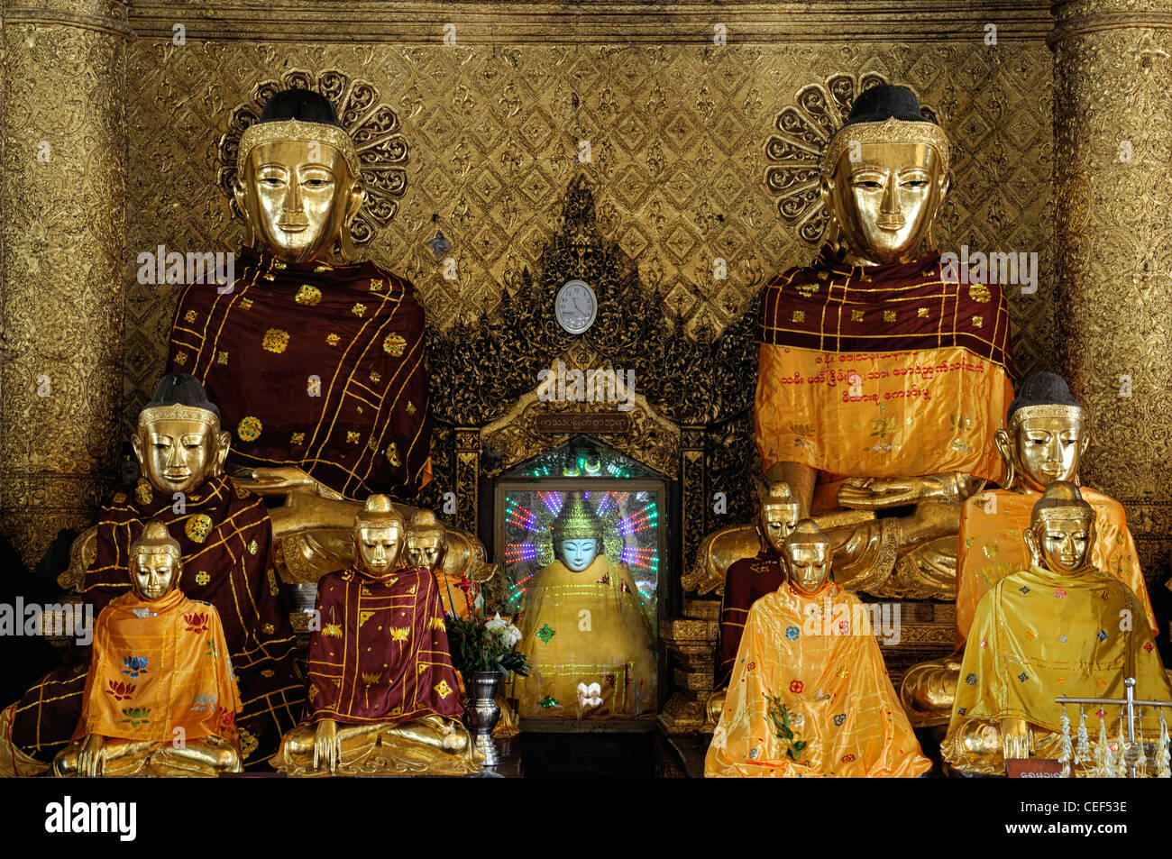 statue statues buddha buddhist gold orange yellow robe robes robed ...