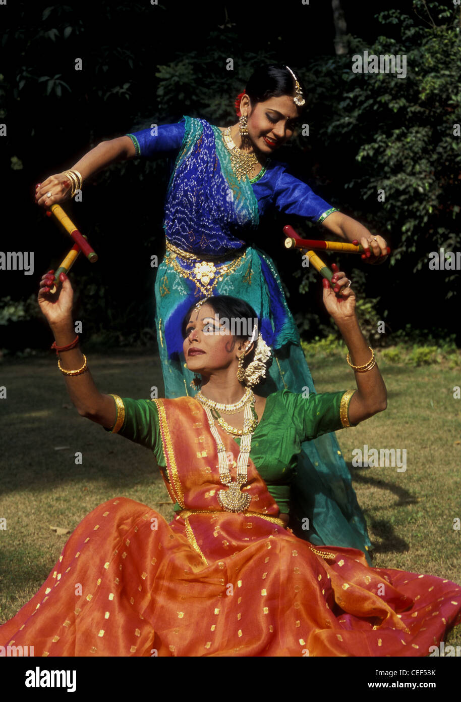 Two women dancing the "stick dance" from Gujarat Stock Photo - Alamy