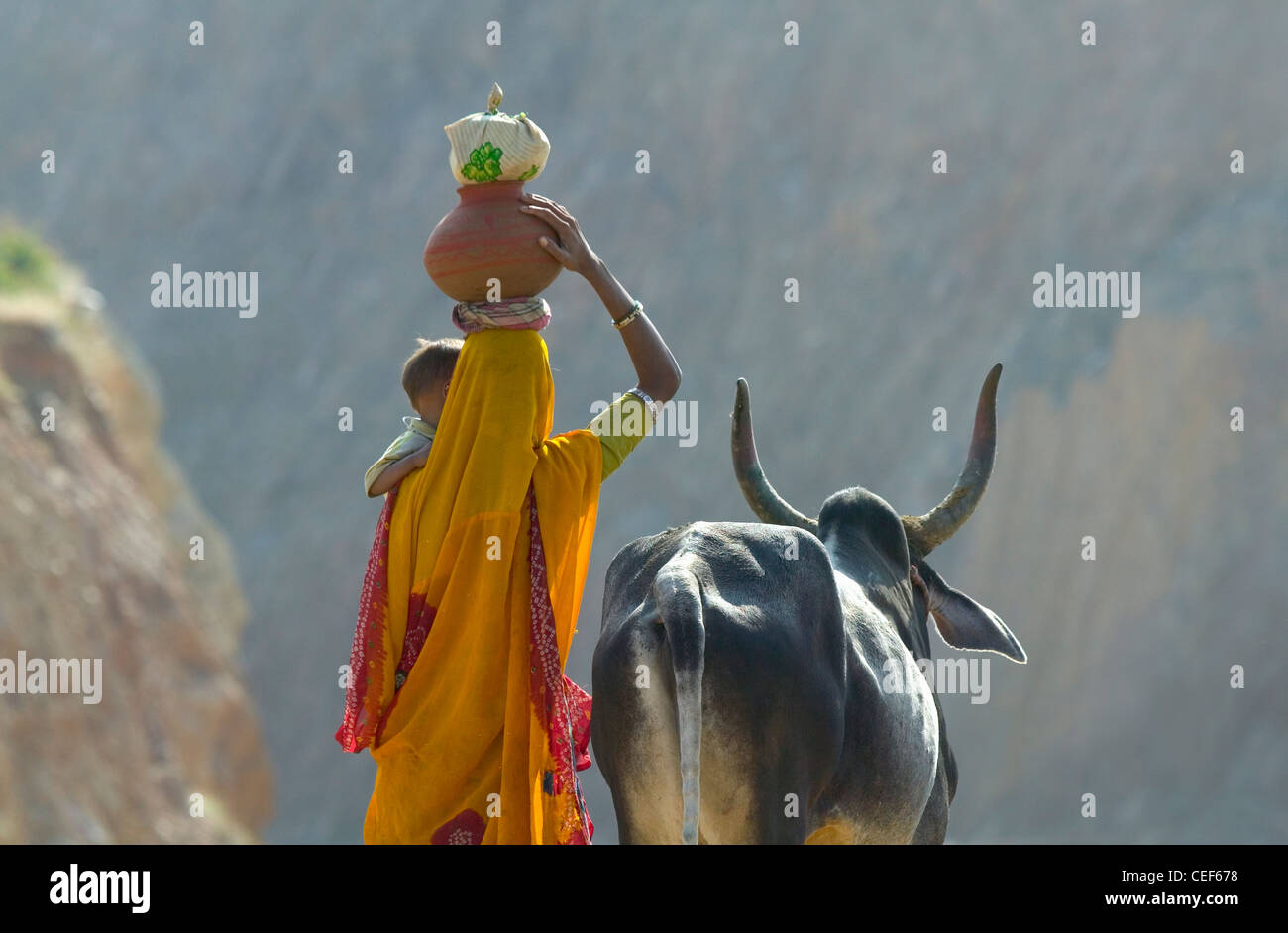 Indian woman carrying baby on hi-res stock photography and images - Alamy