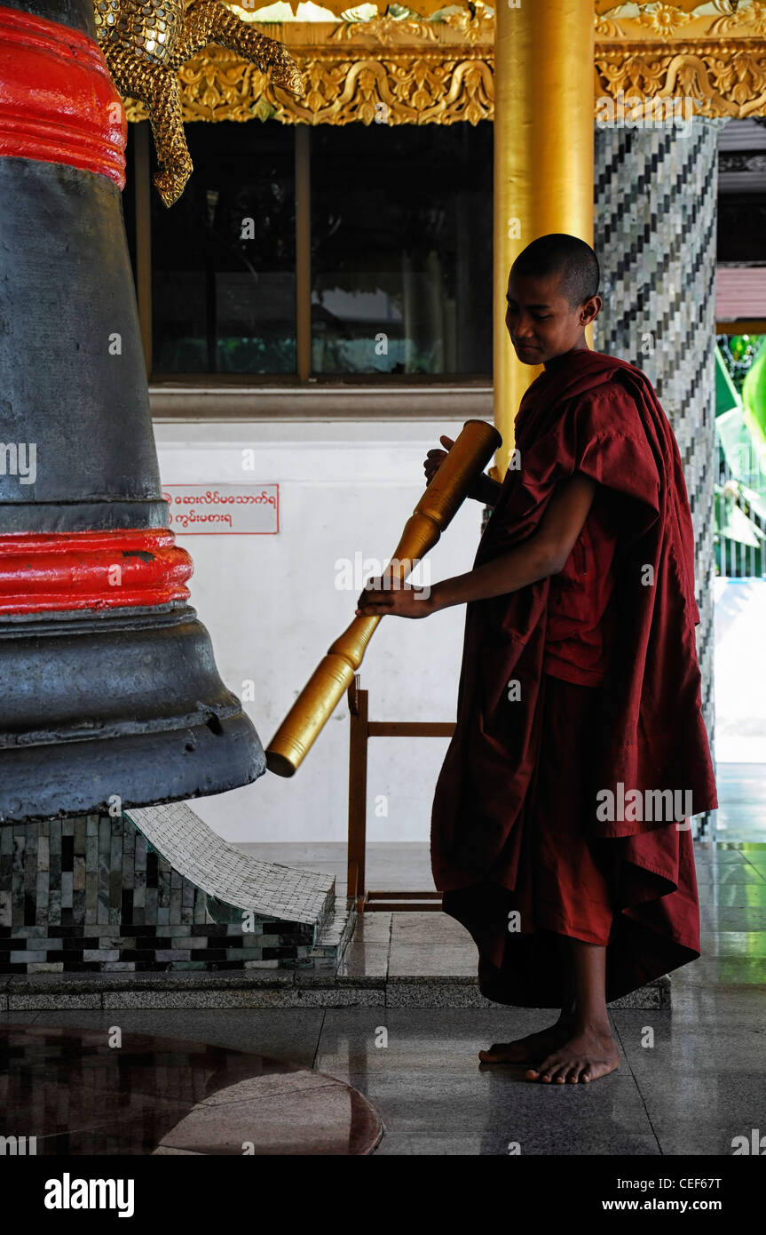 red robed buddhist monk ring ringing bell meditate meditation Shwedagon ...