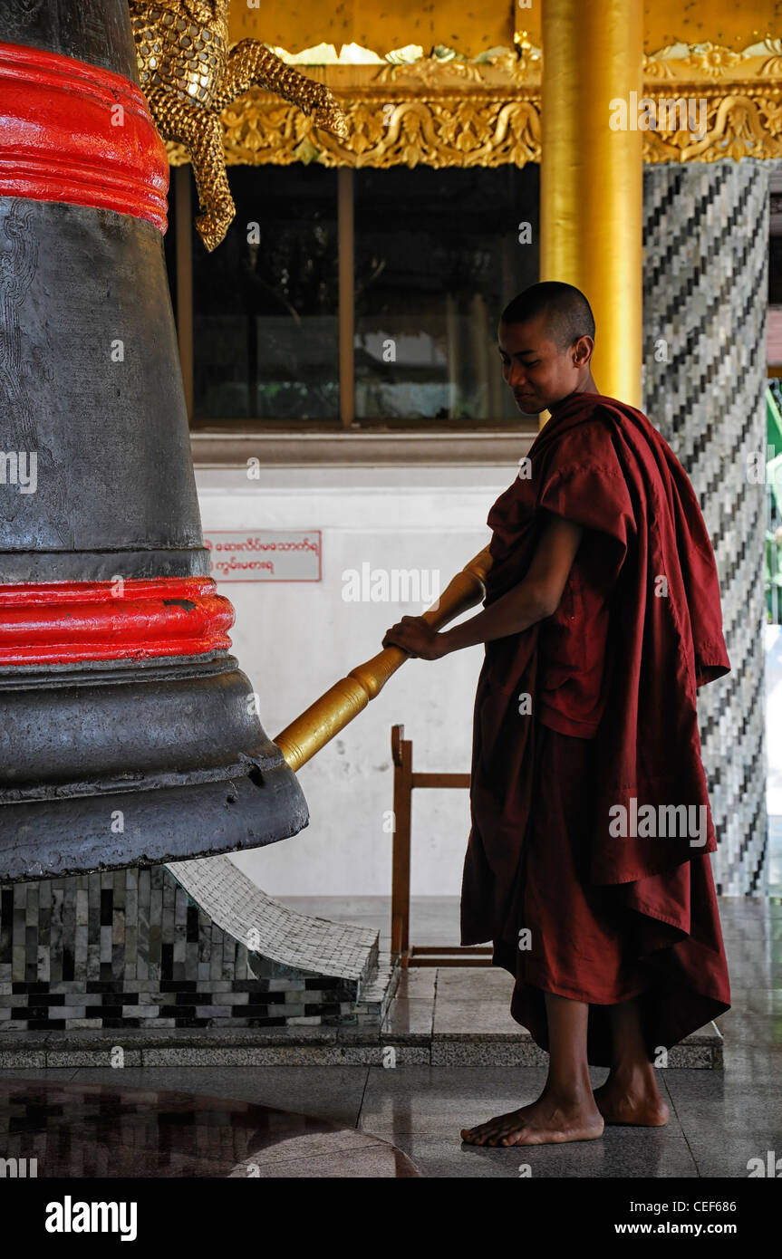 red robed buddhist monk ring ringing bell meditate meditation Shwedagon ...
