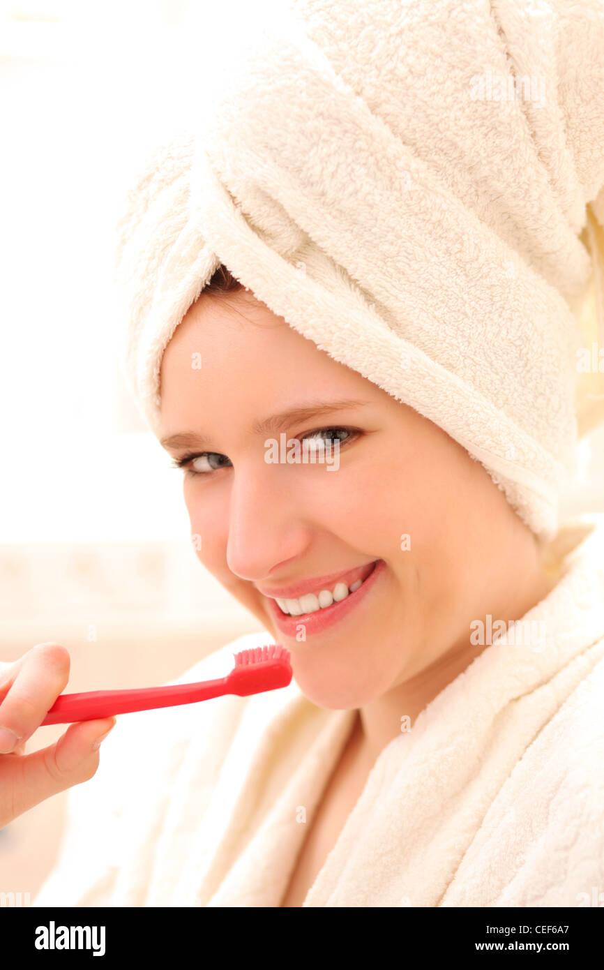 Teenager girl cleaning teeth Stock Photo - Alamy