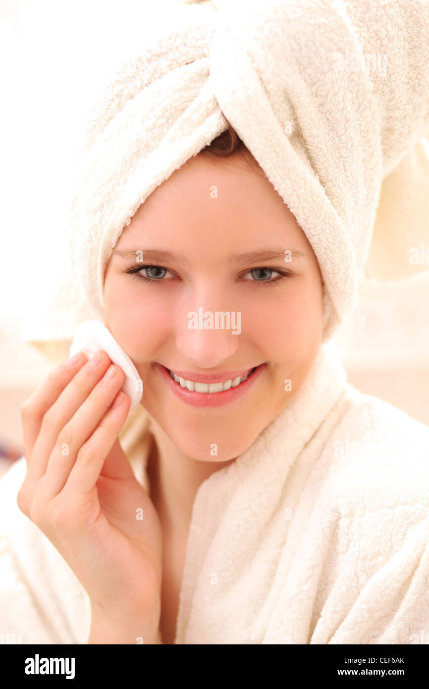 Girl using cotton pad Stock Photo - Alamy