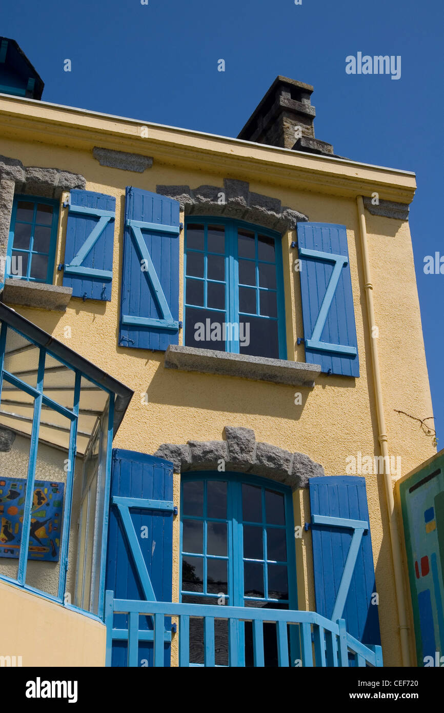 French house, Blue painted shutters and windows frames. Yellow walls ...
