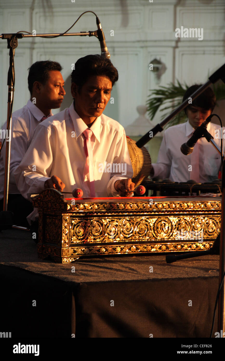 Thai musician performing a Ranat Ek (traditional Thai xylophone Stock ...
