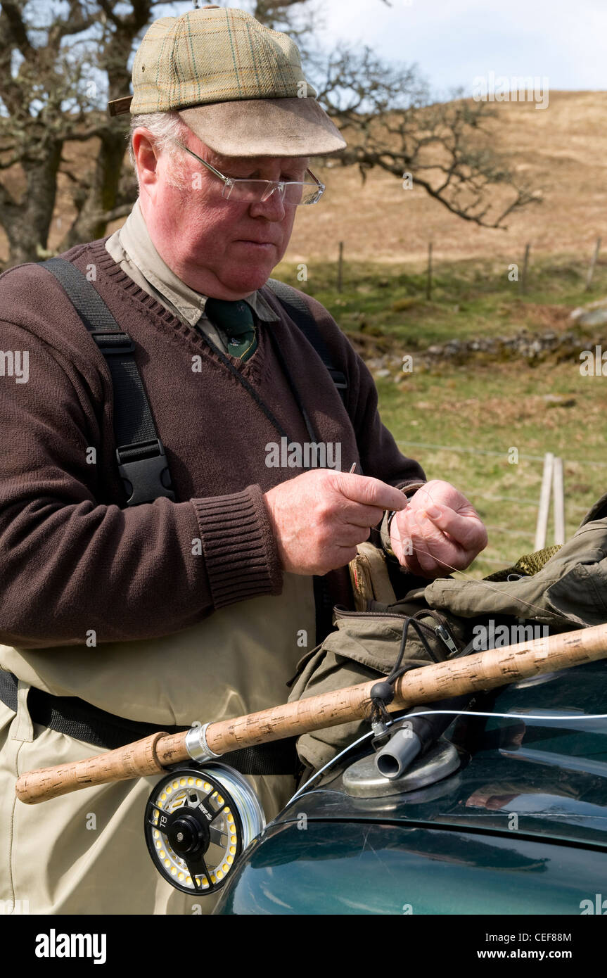 Man preparing to go Salmon Fishing, River Oykel, Sutherland, Scotland ...