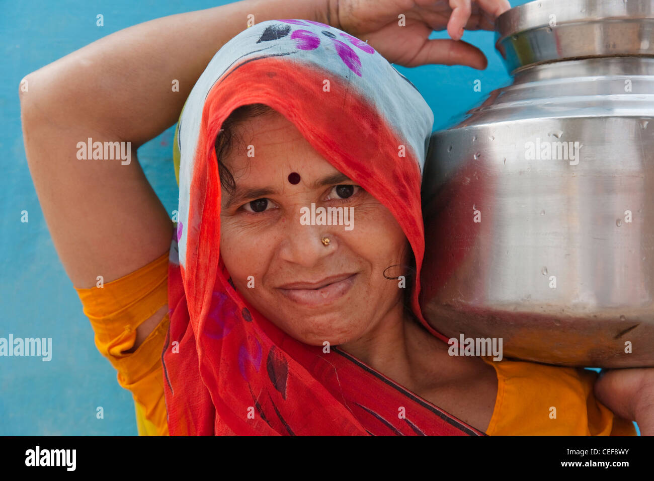 Indian girl carrying water jar, Agra, India Stock Photo - Alamy