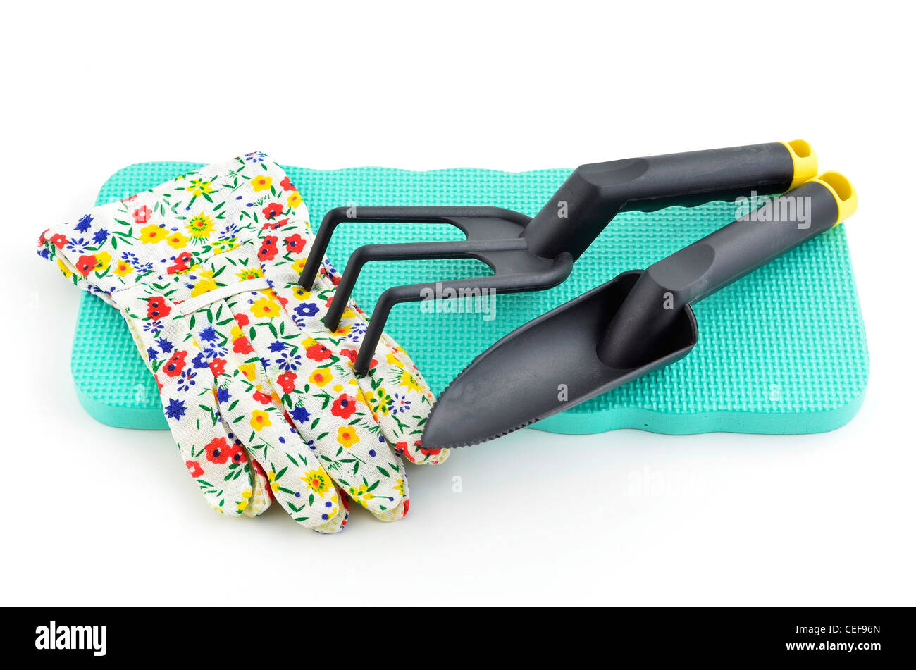 Kneeling pad, gloves and hand gardening tools on white background in ...