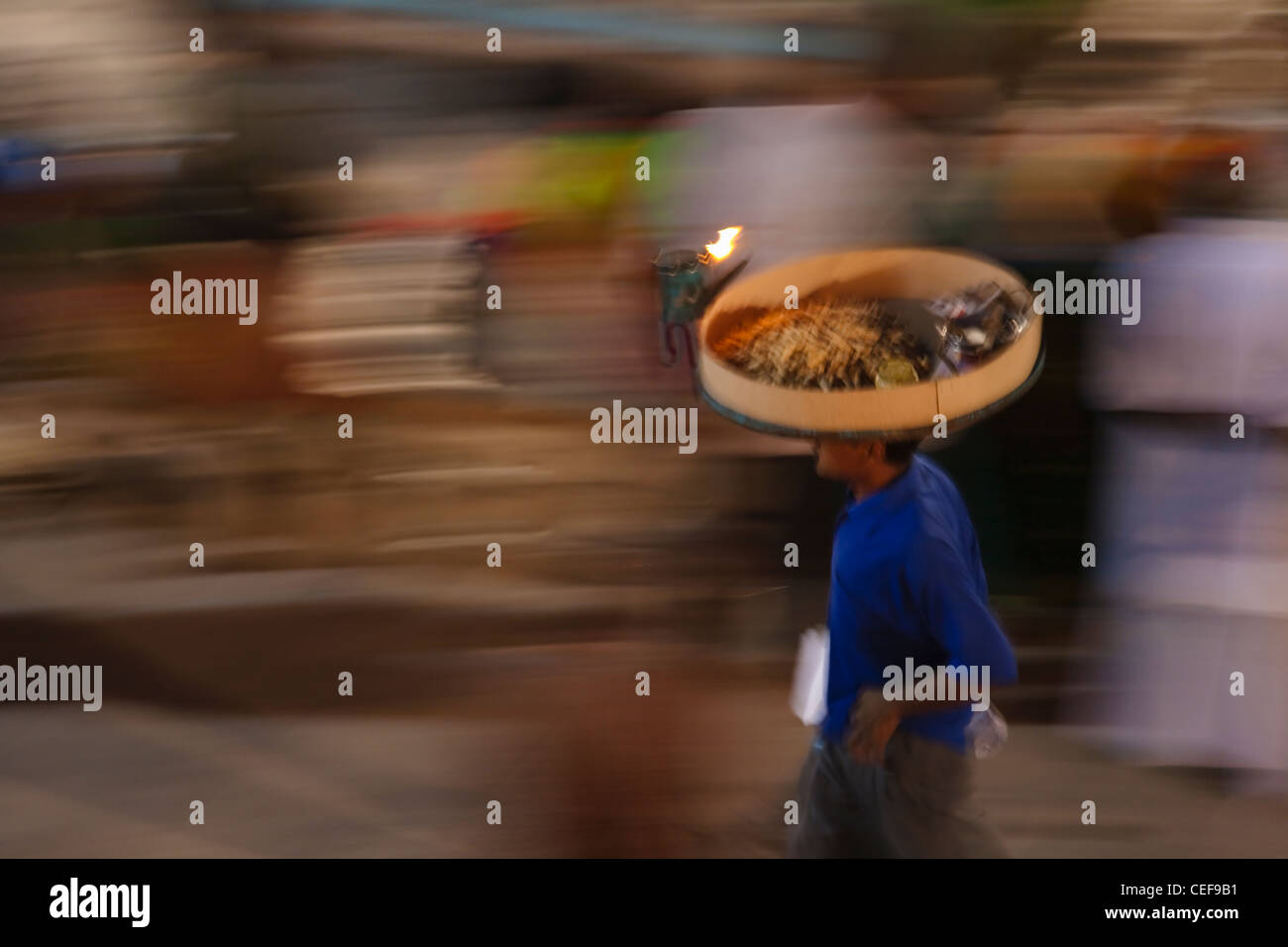 Man carrying basket on the street, Varanasi, India Stock Photo - Alamy