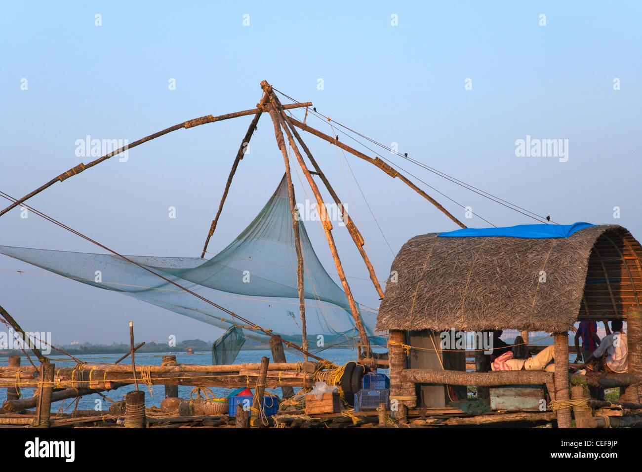 Fishing with Chinese fishing net on the beach, Kochi, Kerala, India ...