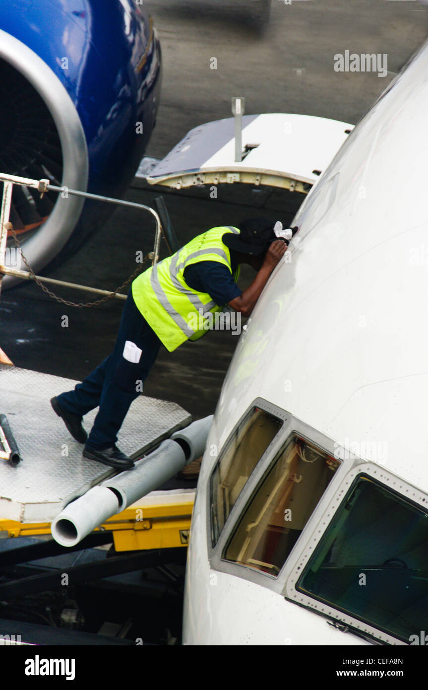 man peeking into the plane to bring in food Stock Photo - Alamy