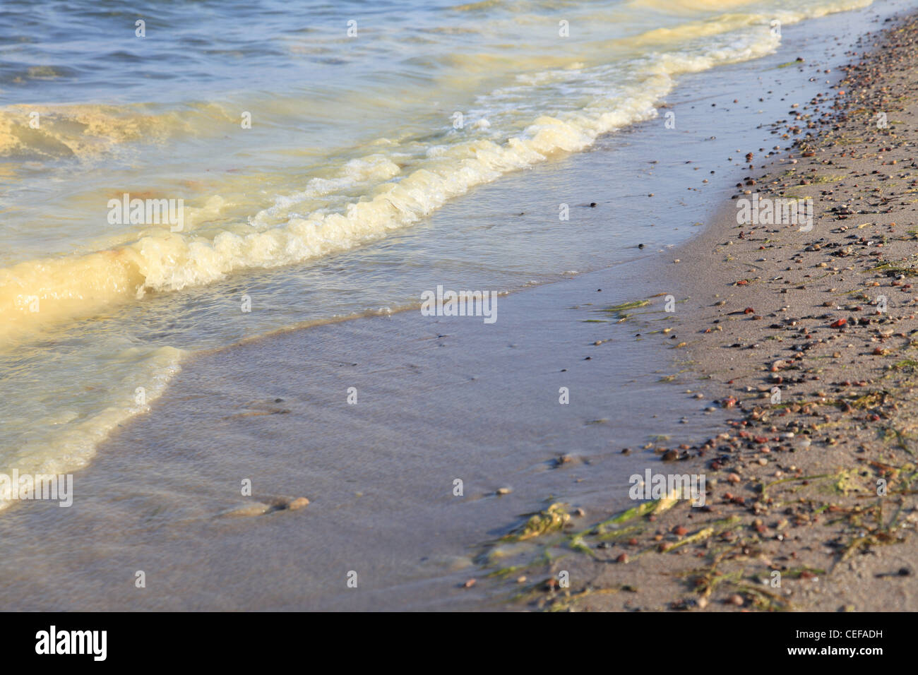 spill disaster on sea yellow pollution Stock Photo - Alamy