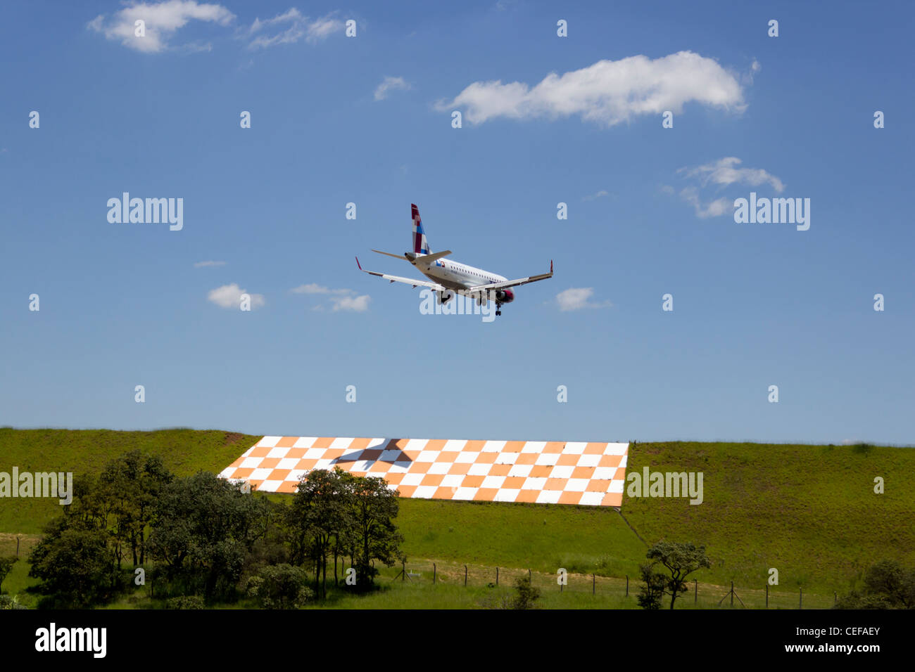 Commercial airplane landing. Company logo and colors were digitally ...