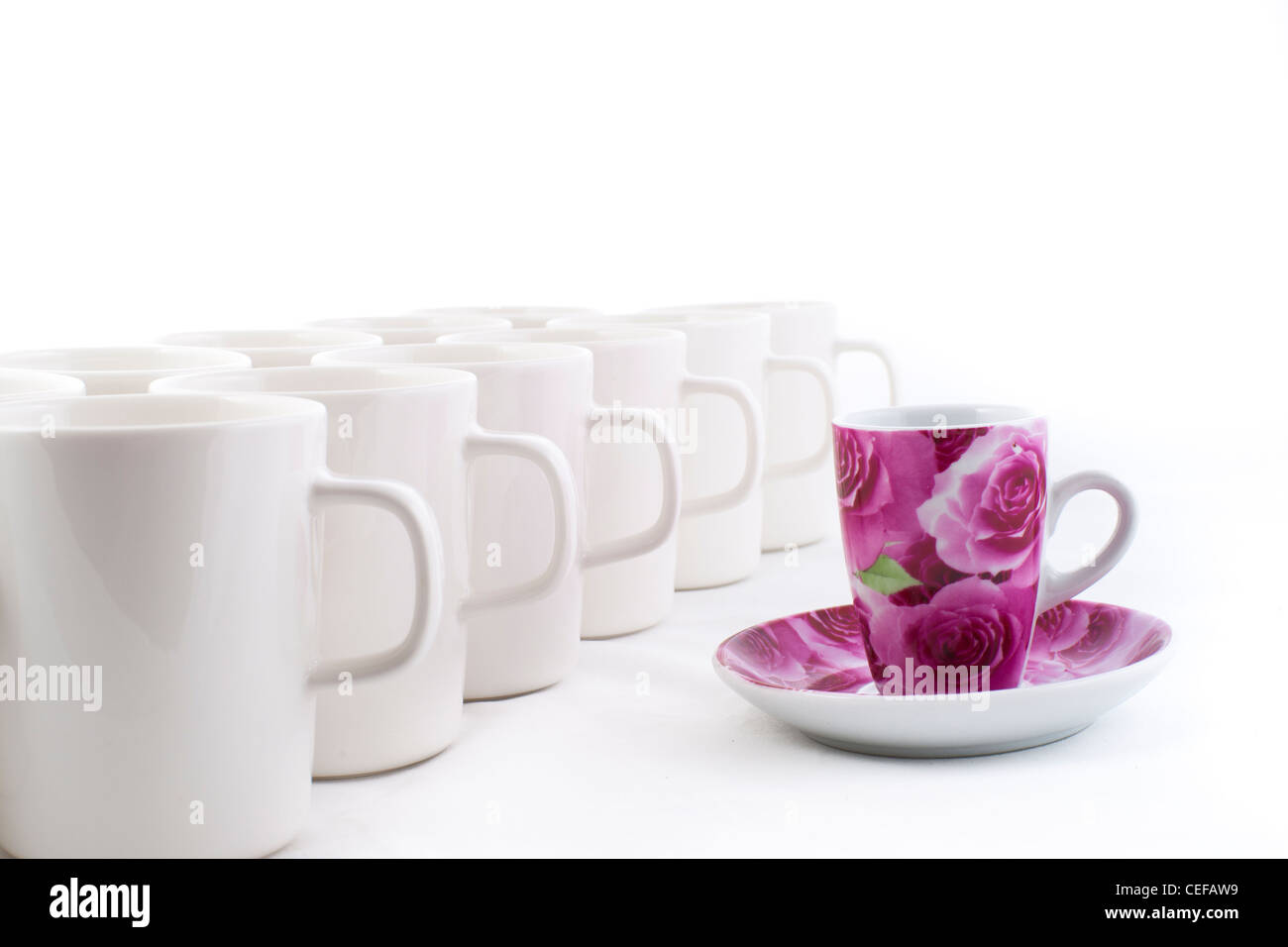 Line of white cups, on white background Stock Photo - Alamy